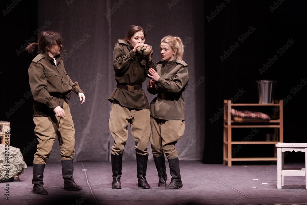 Actors in military uniforms of the Soviet army of World War II play a ...