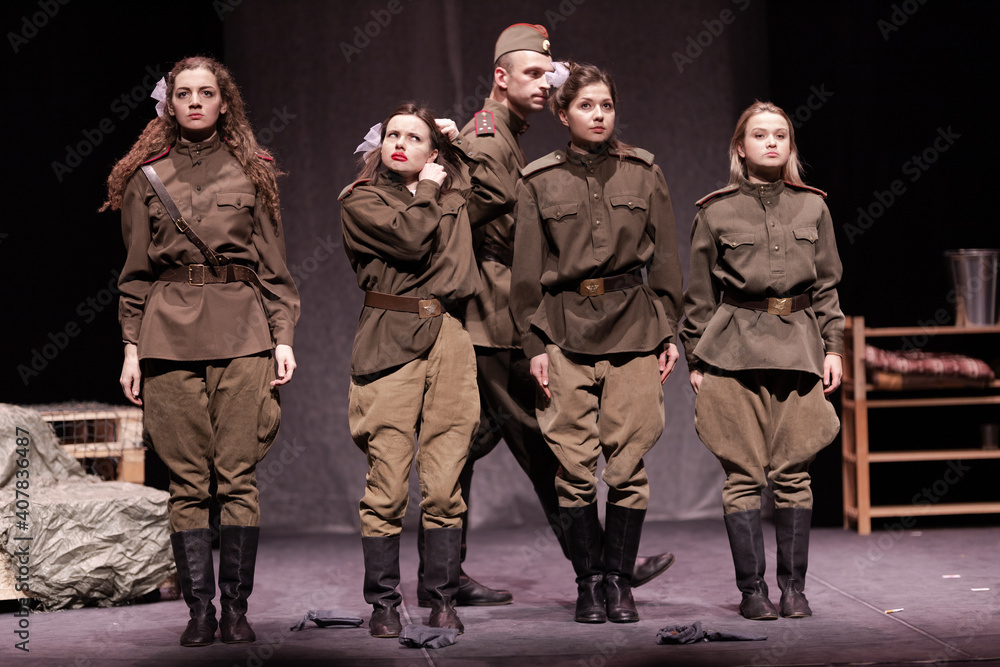 Actors in military uniforms of the Soviet army of World War II play a ...