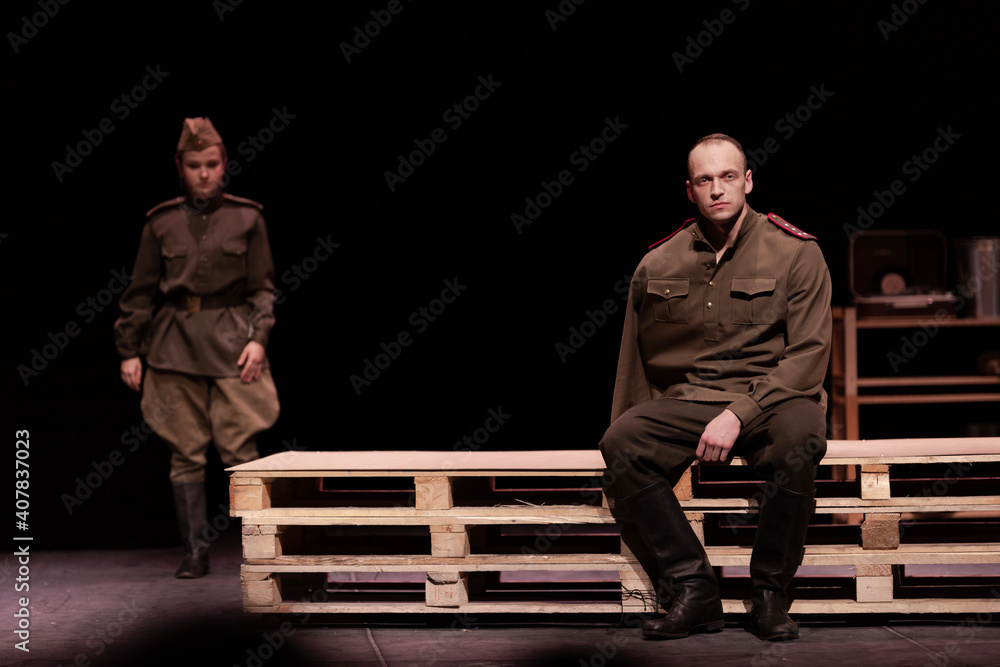 Actors in military uniforms of the Soviet army of World War II play a ...