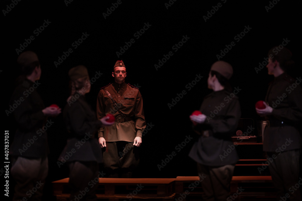 Actors in military uniforms of the Soviet army of World War II play a ...