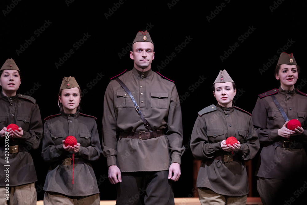 Actors in military uniforms of the Soviet army of World War II play a ...
