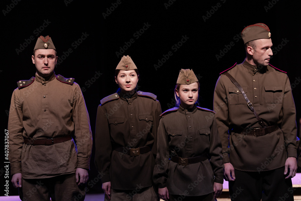 Actors in military uniforms of the Soviet army of World War II play a ...