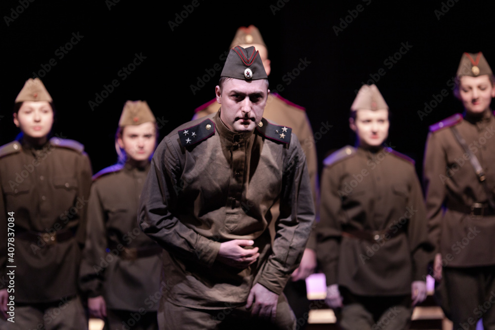Actors in military uniforms of the Soviet army of World War II play a ...