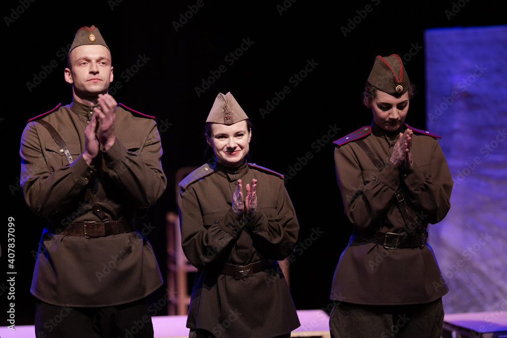 Actors in military uniforms of the Soviet army of World War II play a ...