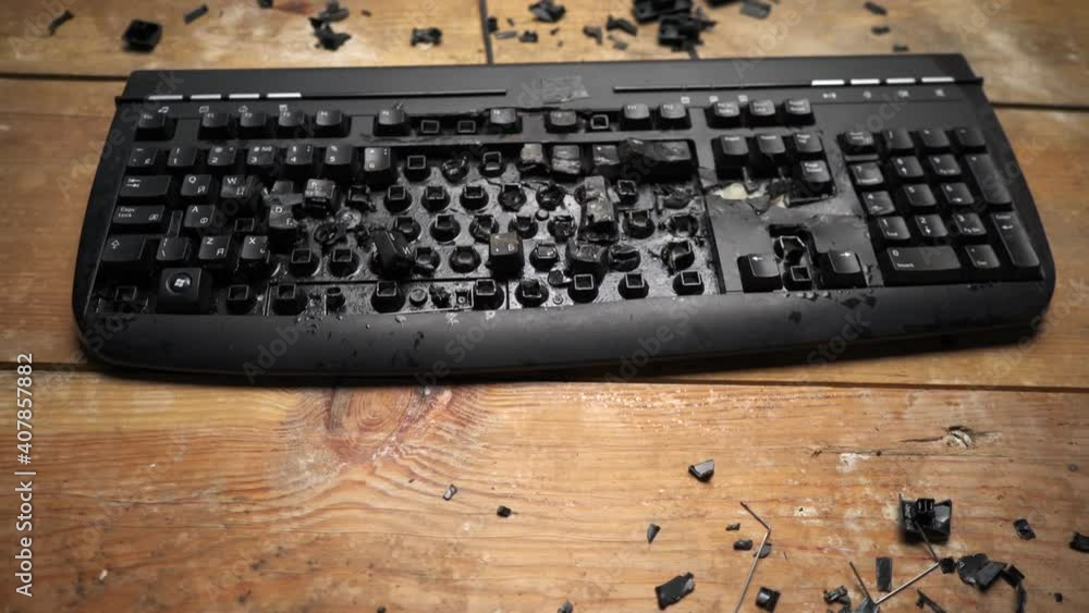 Shattered desktop keyboard. The losing computer player broke the ...