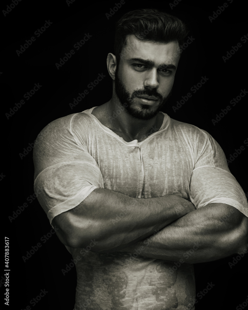Portrait of handsome male fitness model crossing his arms Stock Photo ...
