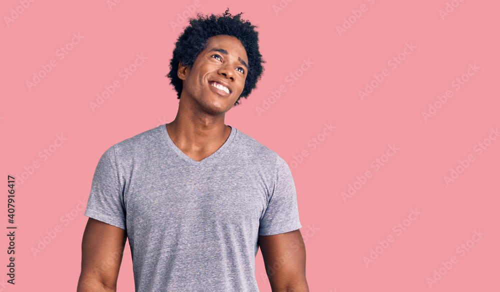 Handsome african american man with afro hair wearing casual clothes ...