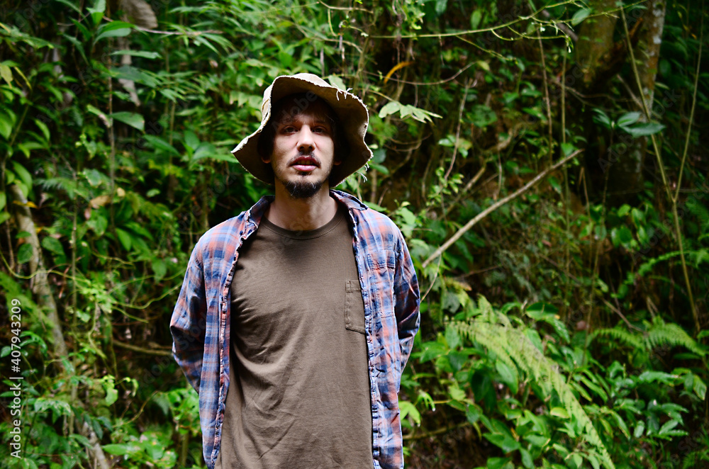 Young male, Puerto Rican farmer working on coffee farm. Farmer standing ...