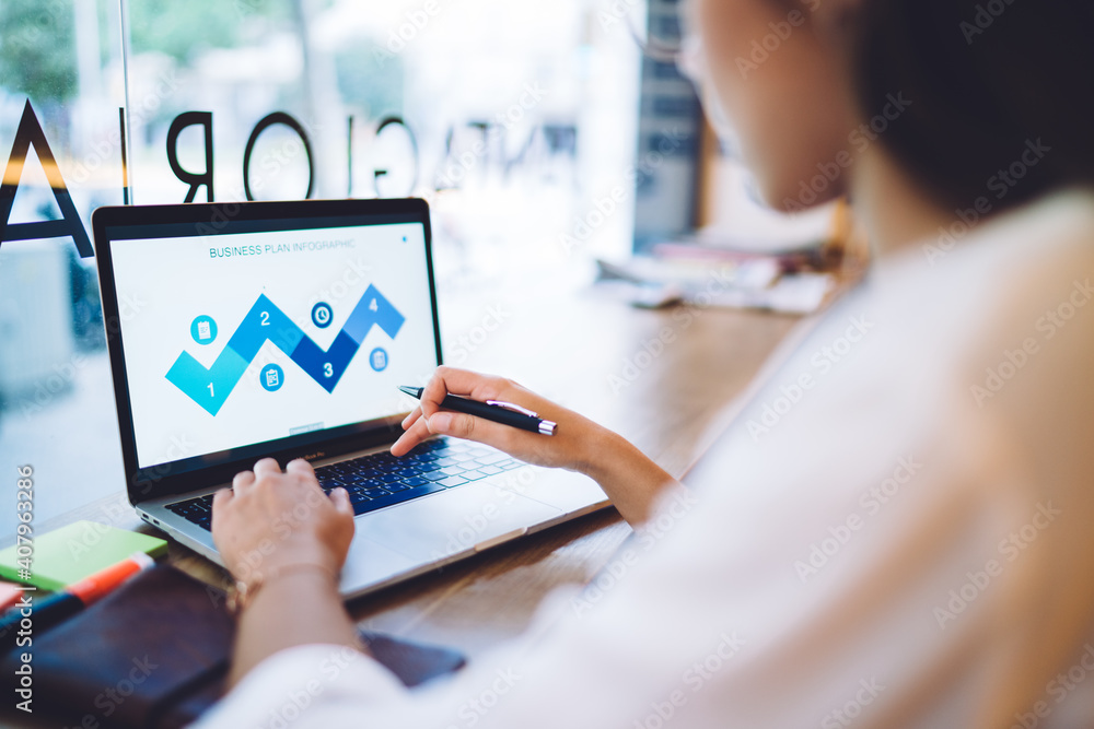Cropped image of caucasian female student learning via laptop computer ...