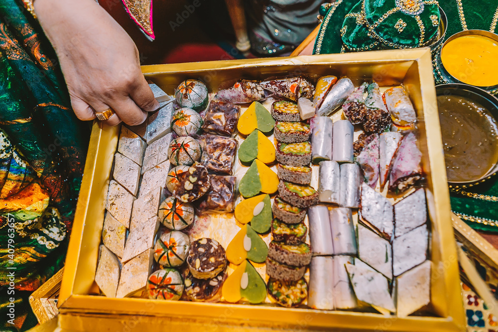 Top view of luxury box of tasty indian sweets, candy with silver ...