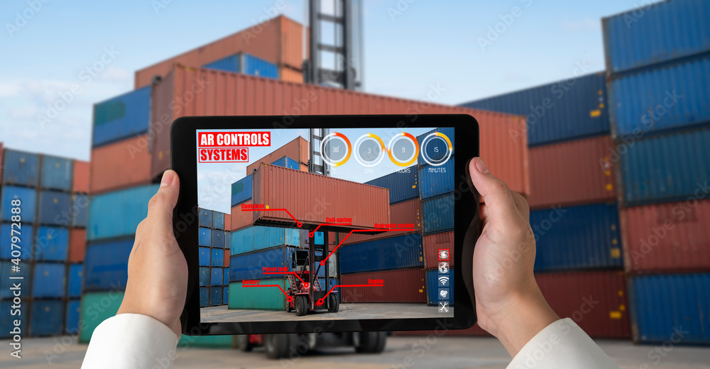 Engineer use augmented reality software in cargo container yard with ...