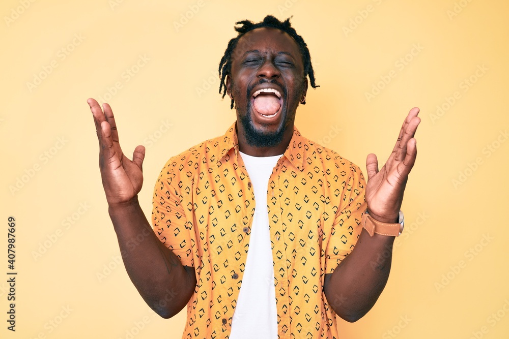 Young african american man with braids wearing casual clothes ...