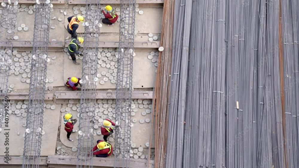 Top aerial view of construction workers work in project building area ...