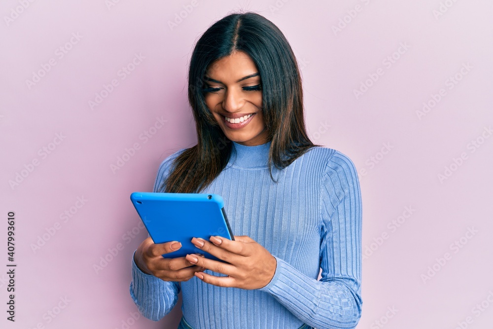 Young Latin Transsexual Transgender Woman Using Touchpad Device Smiling