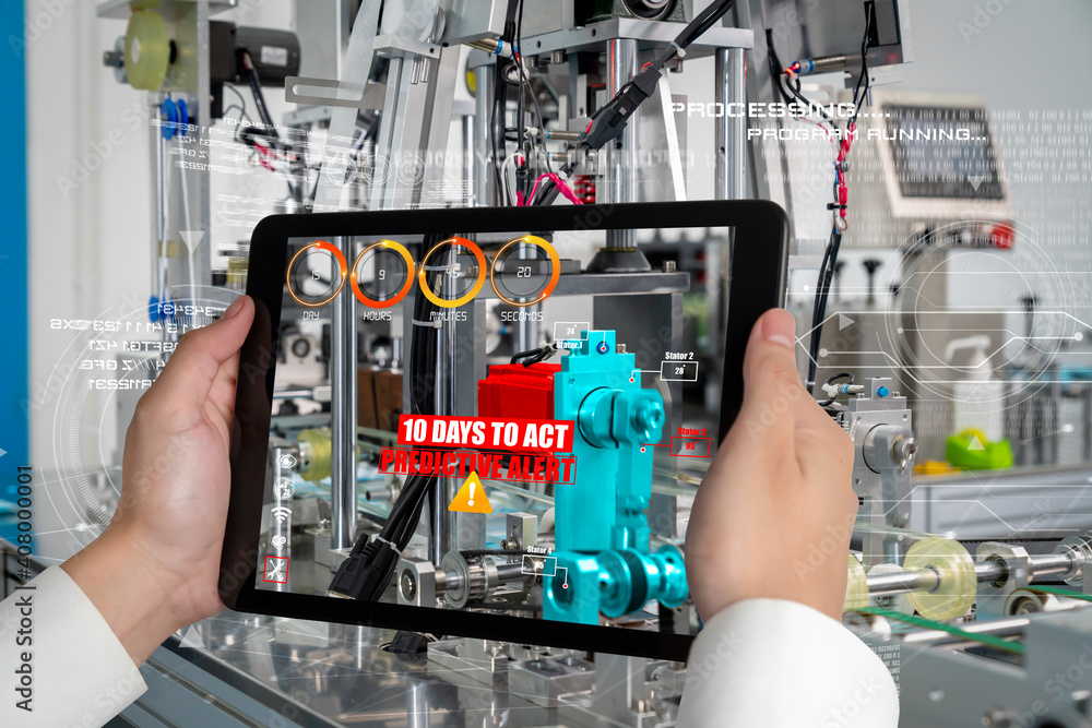 Engineer use augmented reality software in smart factory production ...