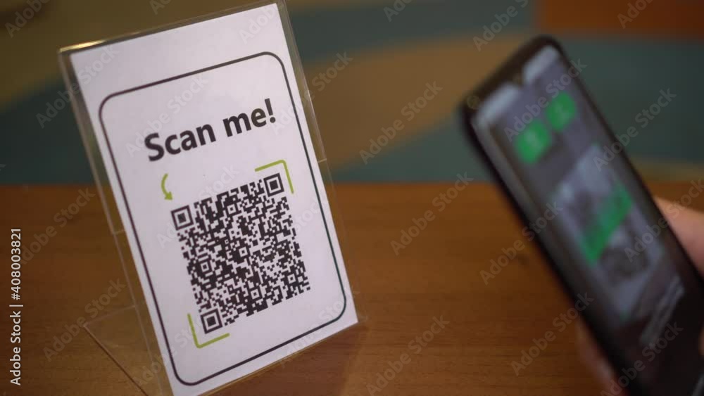 Scanning the QR code on the display using a smartphone. Internet URL ...