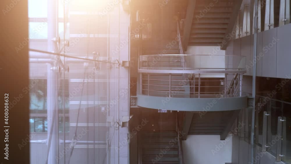 Moving elevator in modern commercial building. The elevator goes up ...