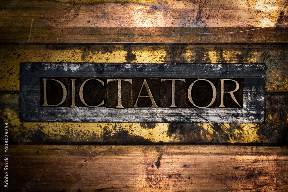 Dictator text on grungy textured authentic copper and gold background ...