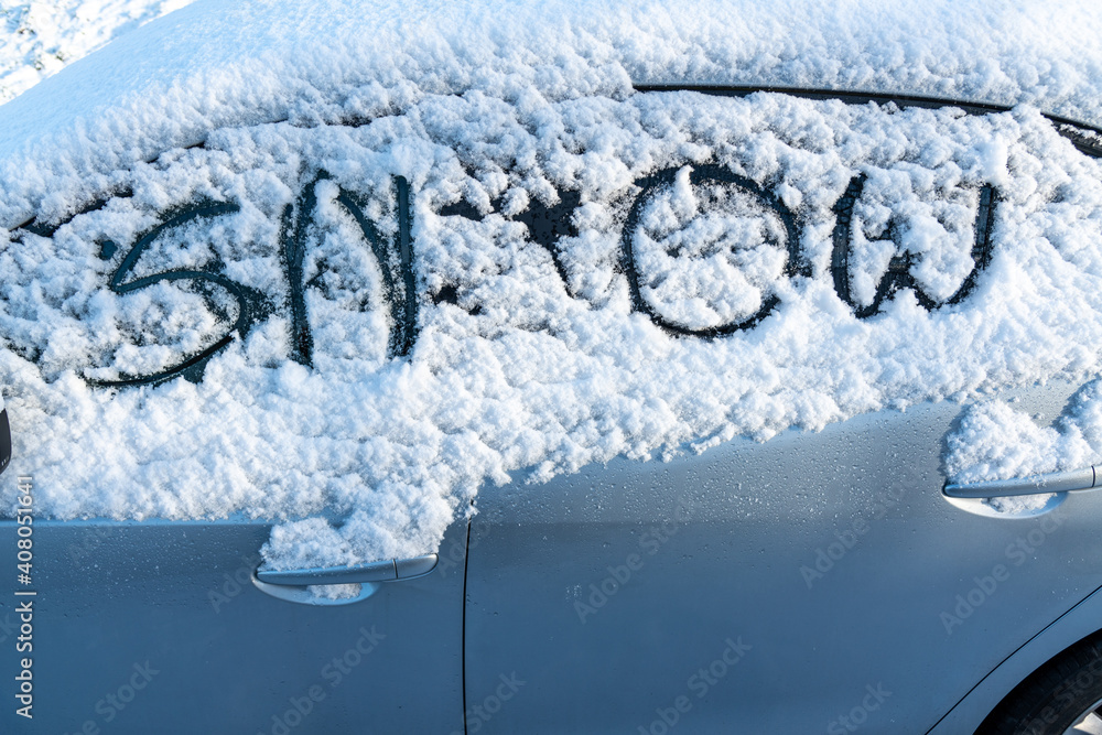 A car under the snow. Snow and ice on cars after extreme snowfall in ...