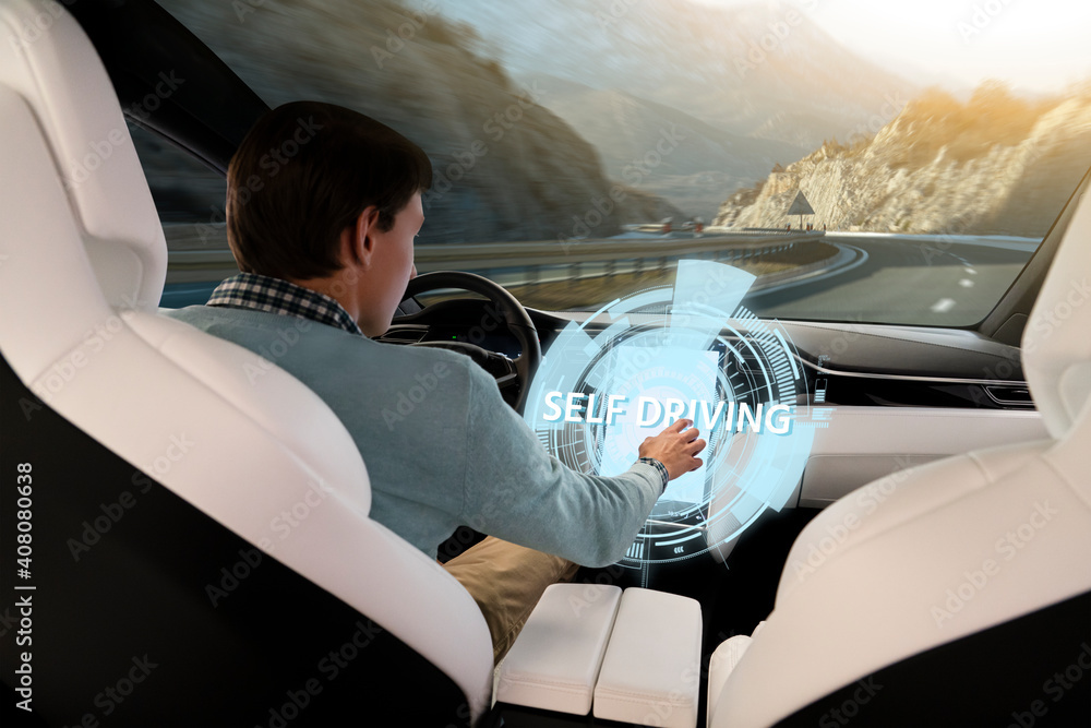 Driver controls an autonomous car using touch screen Stock Photo ...