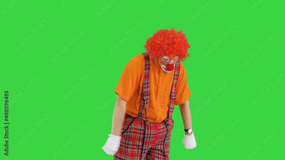 Unhappy clown standing and being nervous on a Green Screen, Chroma Key ...