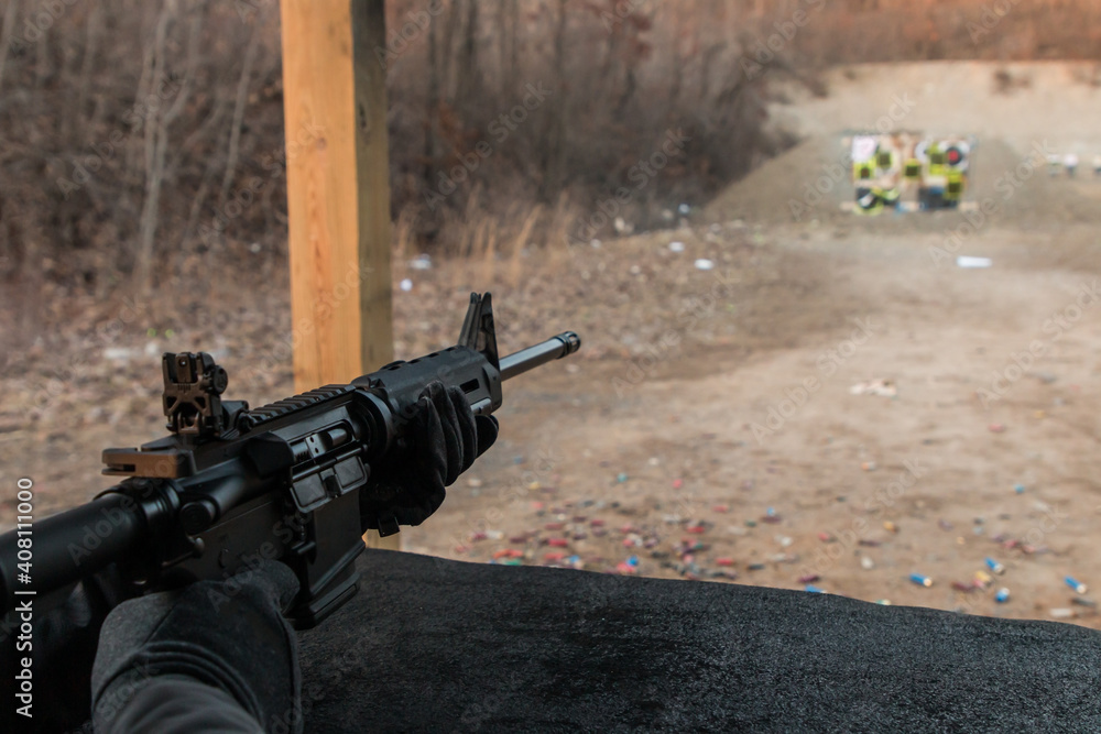 Person shooting a semi-automatic AR-15 assault weapon rifle at an ...