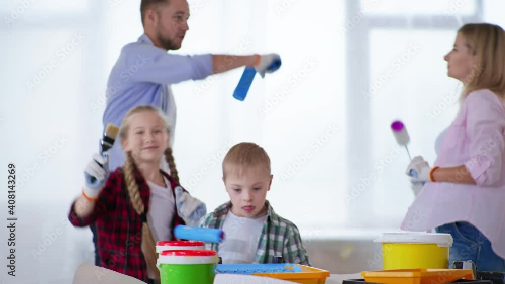 cheerful happy family with female children and boy with down syndrome ...