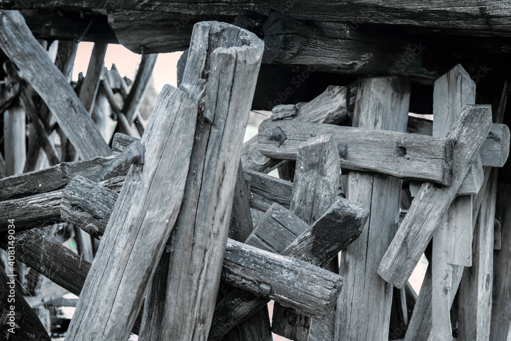 Logs of pillars of an old wooden bridge. Destroyed wooden old bridge ...