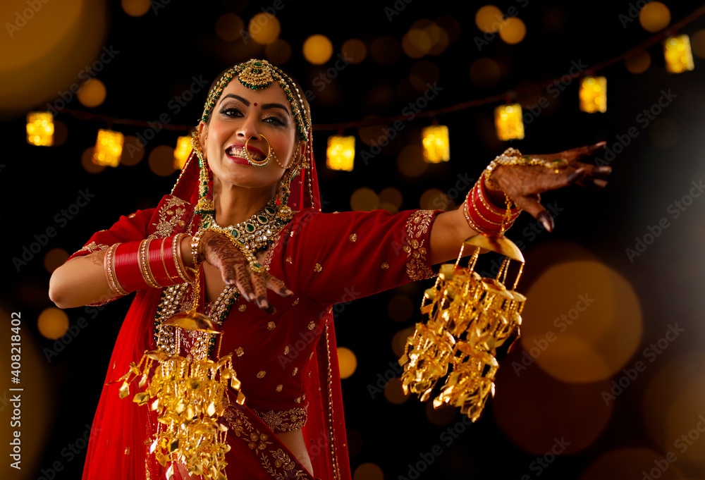 Indian bride dancing at her wedding Stock Photo | Adobe Stock