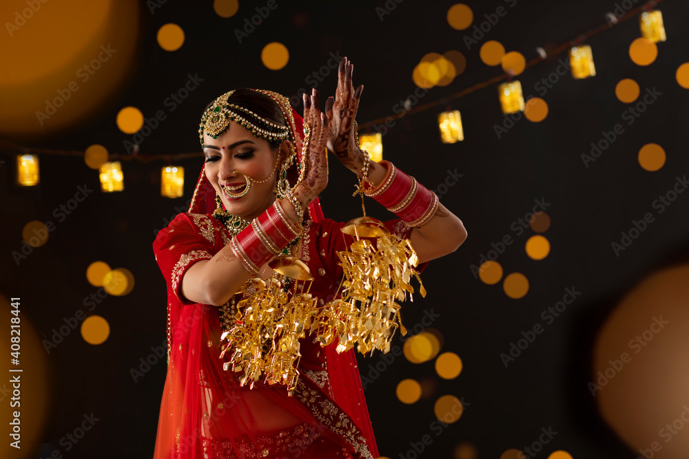 Indian bride dancing at her wedding Stock Photo | Adobe Stock