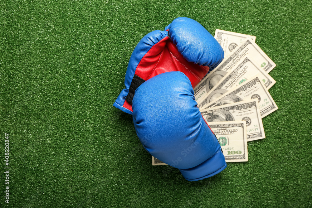 Money and boxing gloves on color background. Concept of sports bet ...