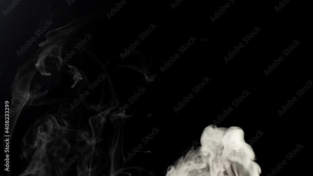 White smoke on a black background. Slow motion. Vape smoke. Vapor , fog ...