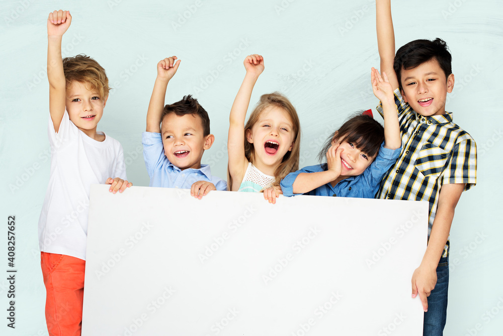 Little kids cheering while holding a white mockup board Stock Photo ...