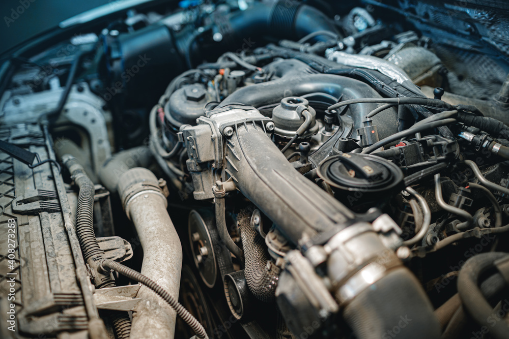Dirty engine under the hood of a car Stock Photo | Adobe Stock