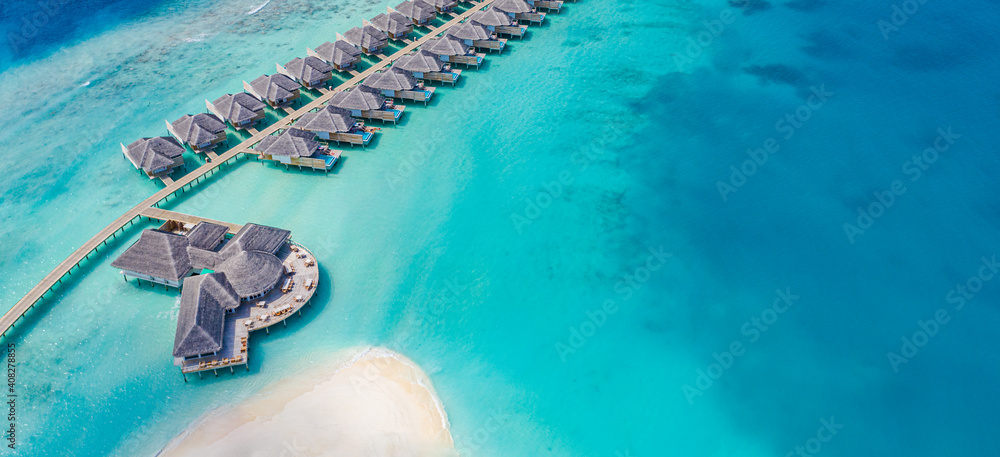 Aerial view of Maldives island, luxury water villas resort and wooden ...