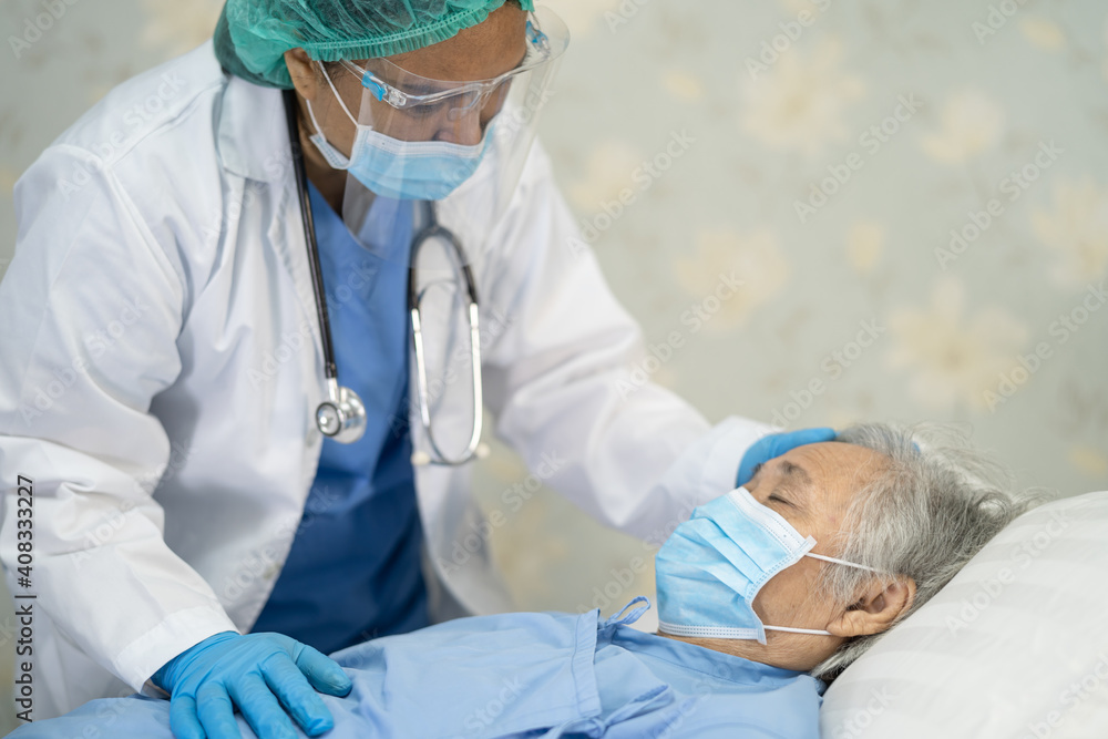 Asian doctor wearing face shield and PPE suit new normal to check ...