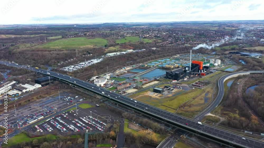 Aerial footage of a a sewage treatment plant and motorway located in ...