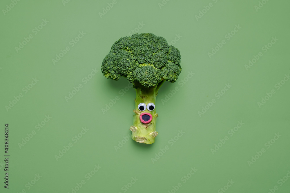 Shocked looking broccoli with googly eyes and mouth on a matching green ...