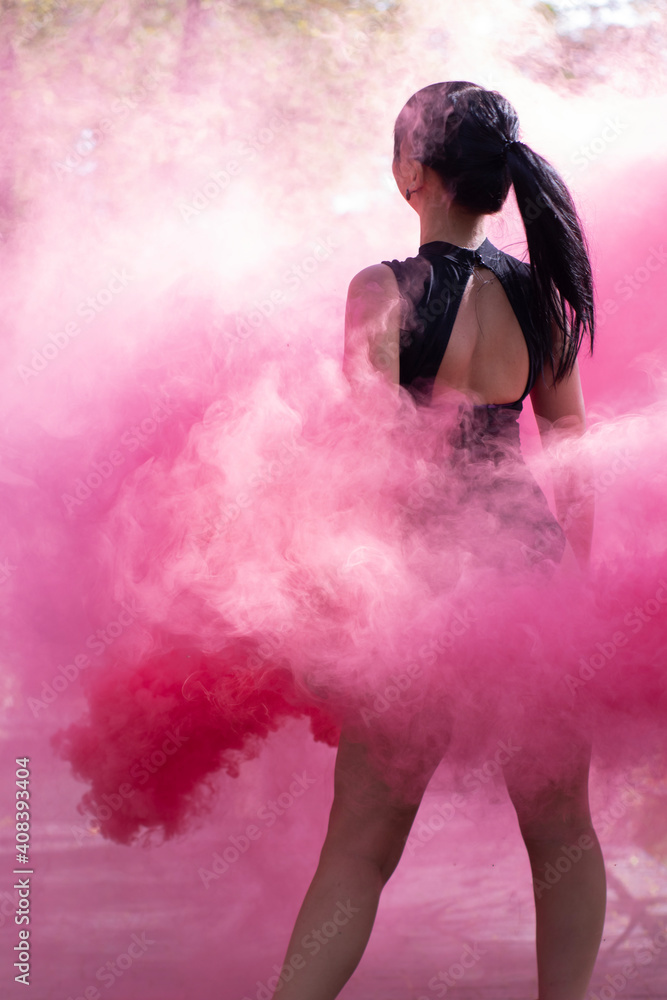 unrecognizable slim girl brunette in black bodysuit with bright pink ...