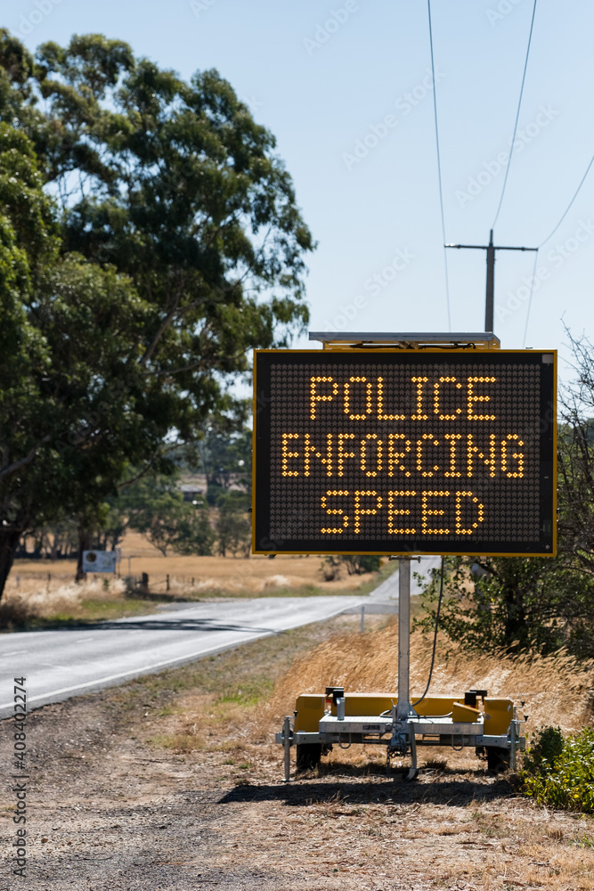 Traffic safety sign with 'Police Enforcing Speed' illuminated Stock ...