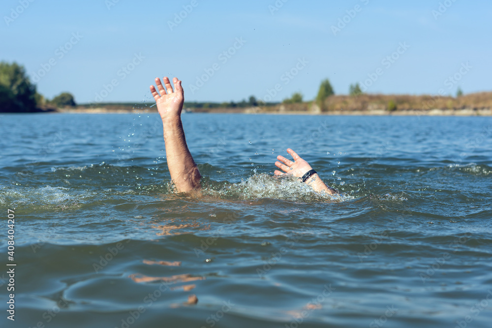Hands of a drowning man above water in need of help Stock Photo | Adobe ...