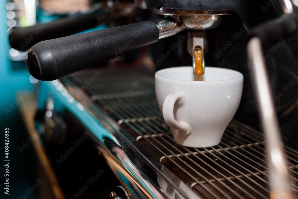 Preparing a cup of cappuccino with a coffee machine. Coffee machine ...