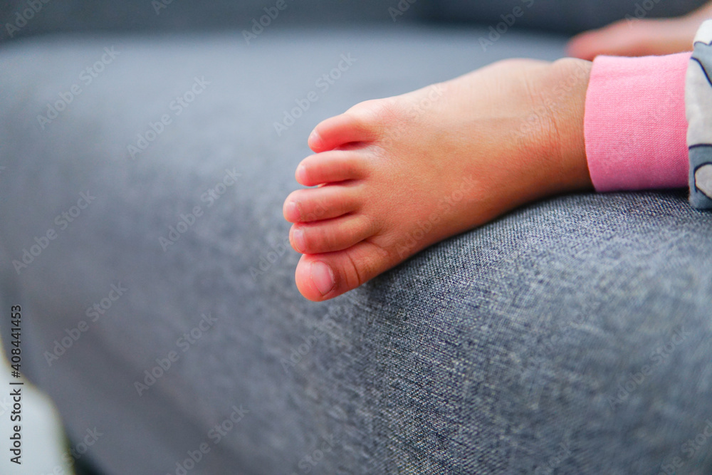 Cute little girl kids tolder feet close up while sleeping. Selective ...