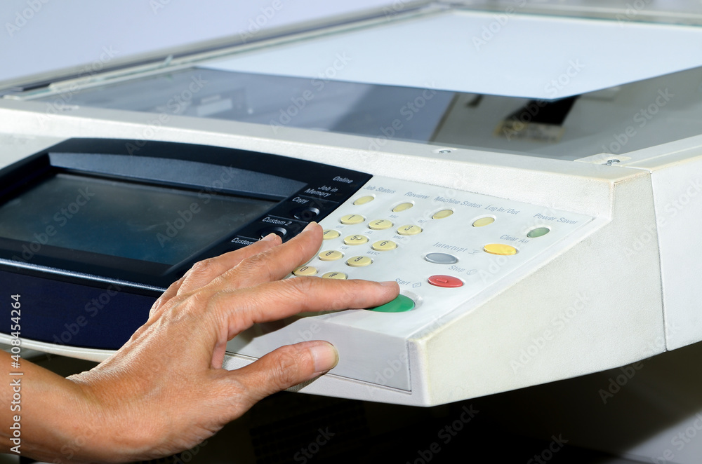 Business woman Hand press button on panel of printer, printer scanner ...