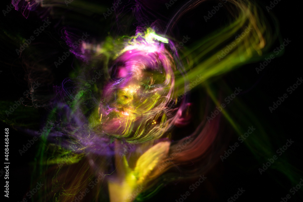 Portrait of young woman amid light painting , Over Black Background ...