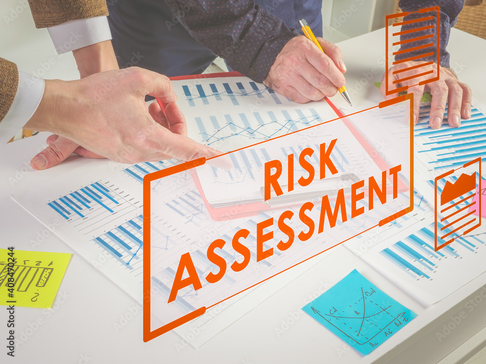 Risk assessment process concept. Colleagues with business report. Stock ...
