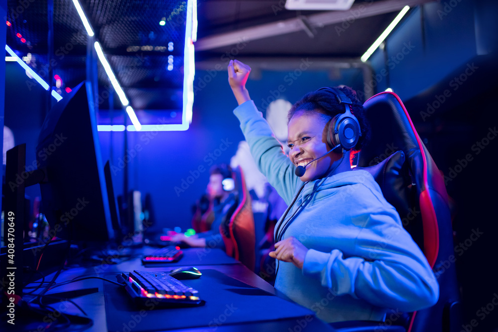 Streamer african young woman rejoices in victory professional gamer ...