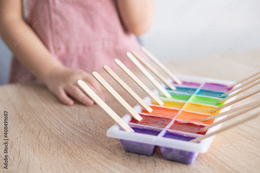 Child take an ice paints. Frozen paint easy process art activity. Stock ...