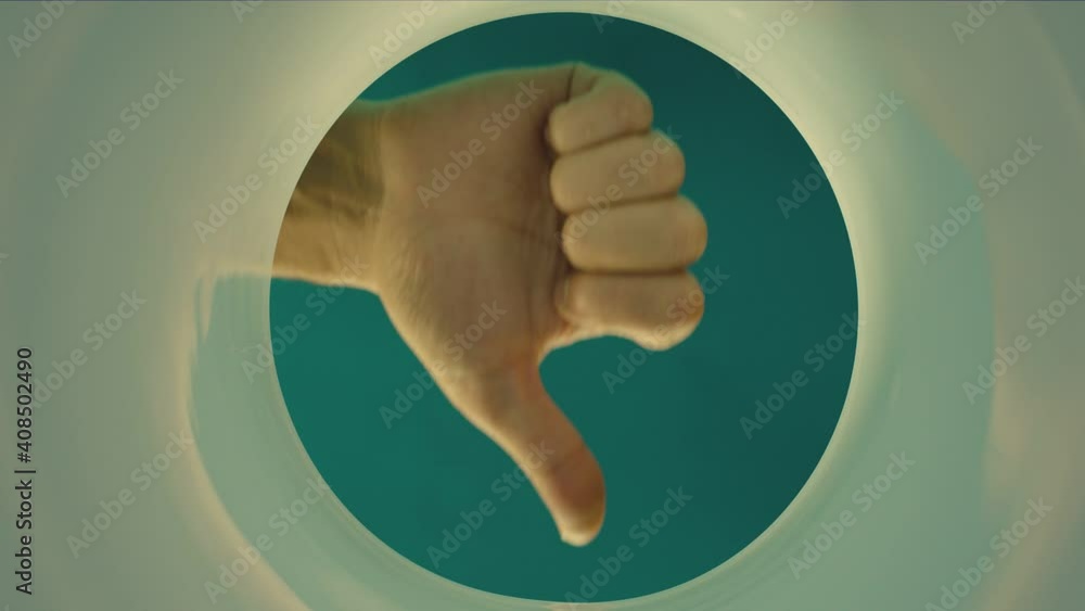 Hand of man showing down big thumb and demonstrating sign of dislike on ...