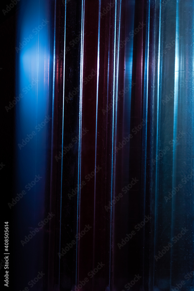 Blurry abstract dynamic futuristic texture of glaring glass sideways ...